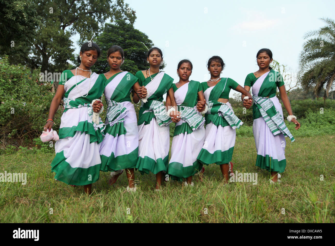 Tribal girls performing a typical tribal dance in traditional outfits ...