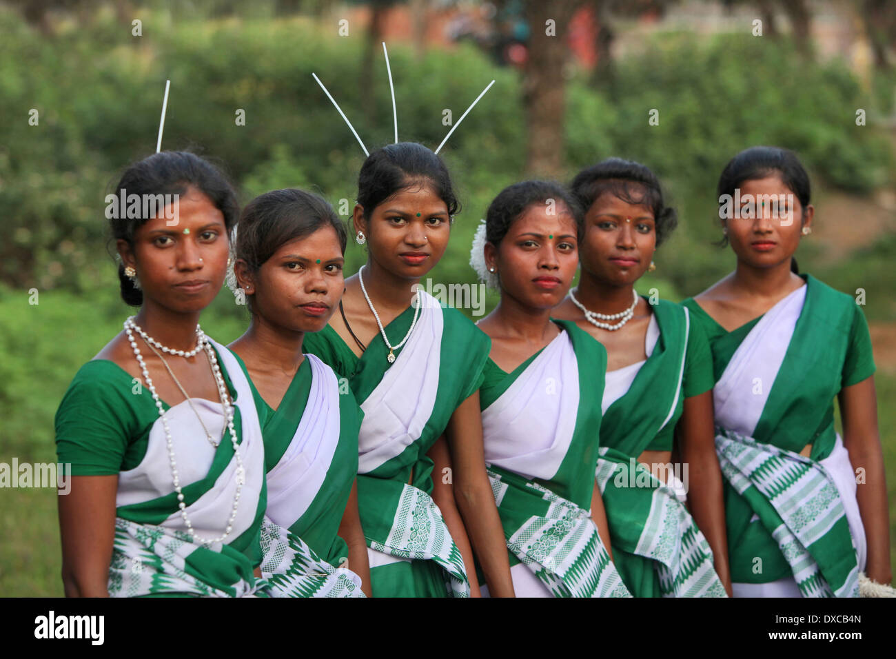 A group of tribal girls in traditional outfits. Oraon tribe. Hurhuru ...