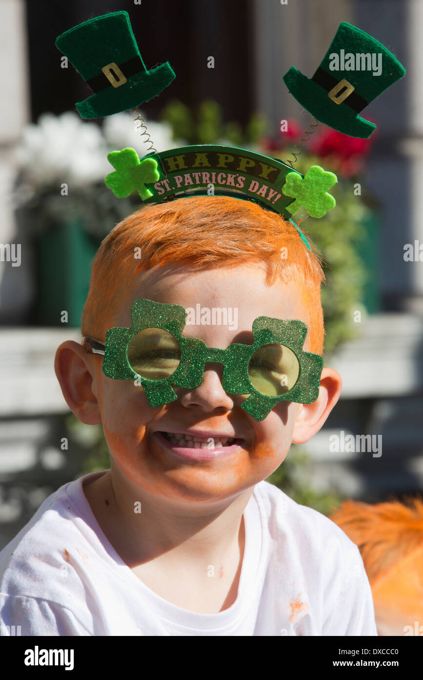 A little boy waits for the start of the parade. St Patrick's Day Parade ...