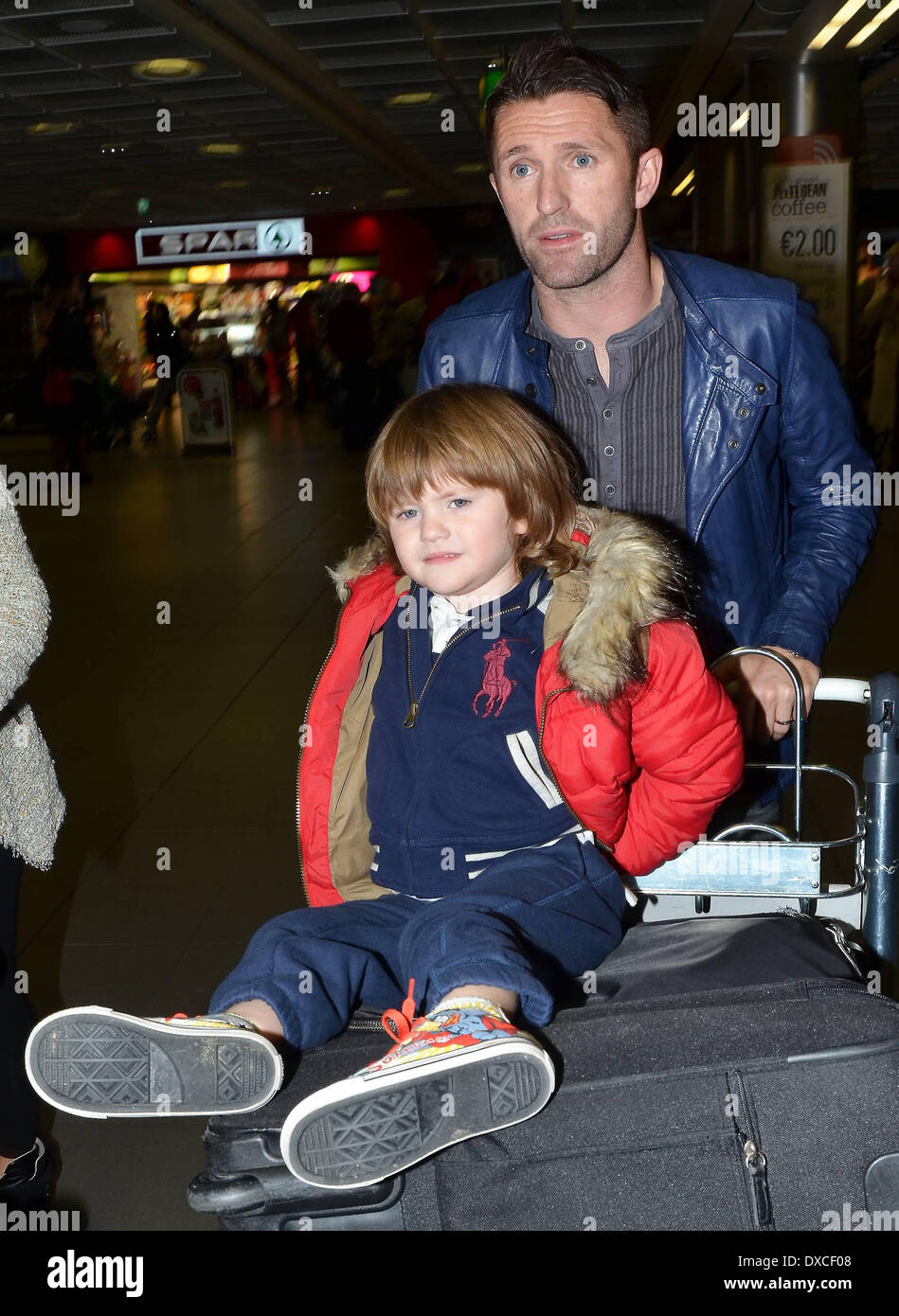 Robbie Keane arriving at Dublin Airport with his son, Robert for the ...