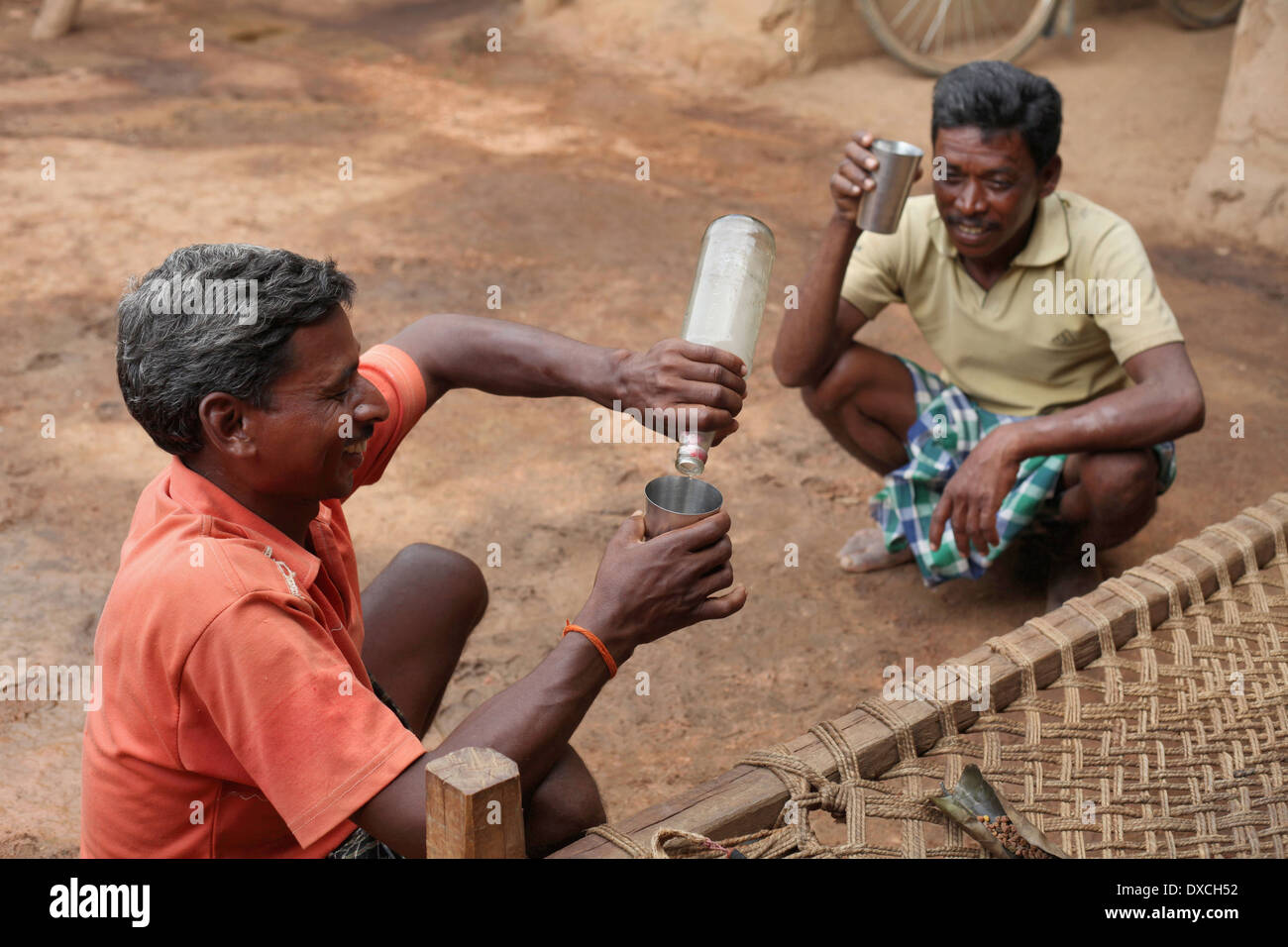Tribal men drinking Khadia (rice beer). Santhal tribe. Jarweadhi ...