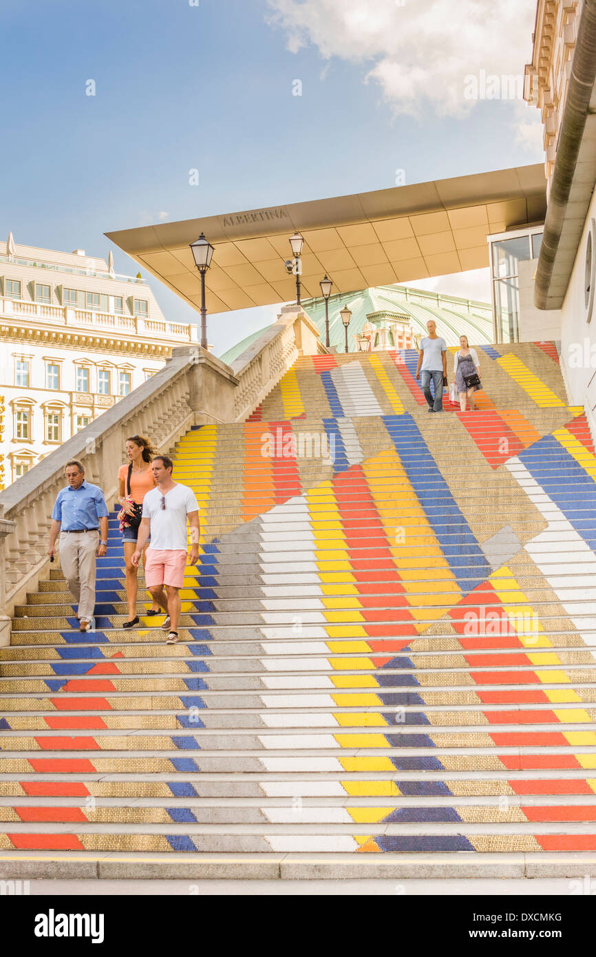 visitors of the albertina museum on the multicolor staircase, vienna ...