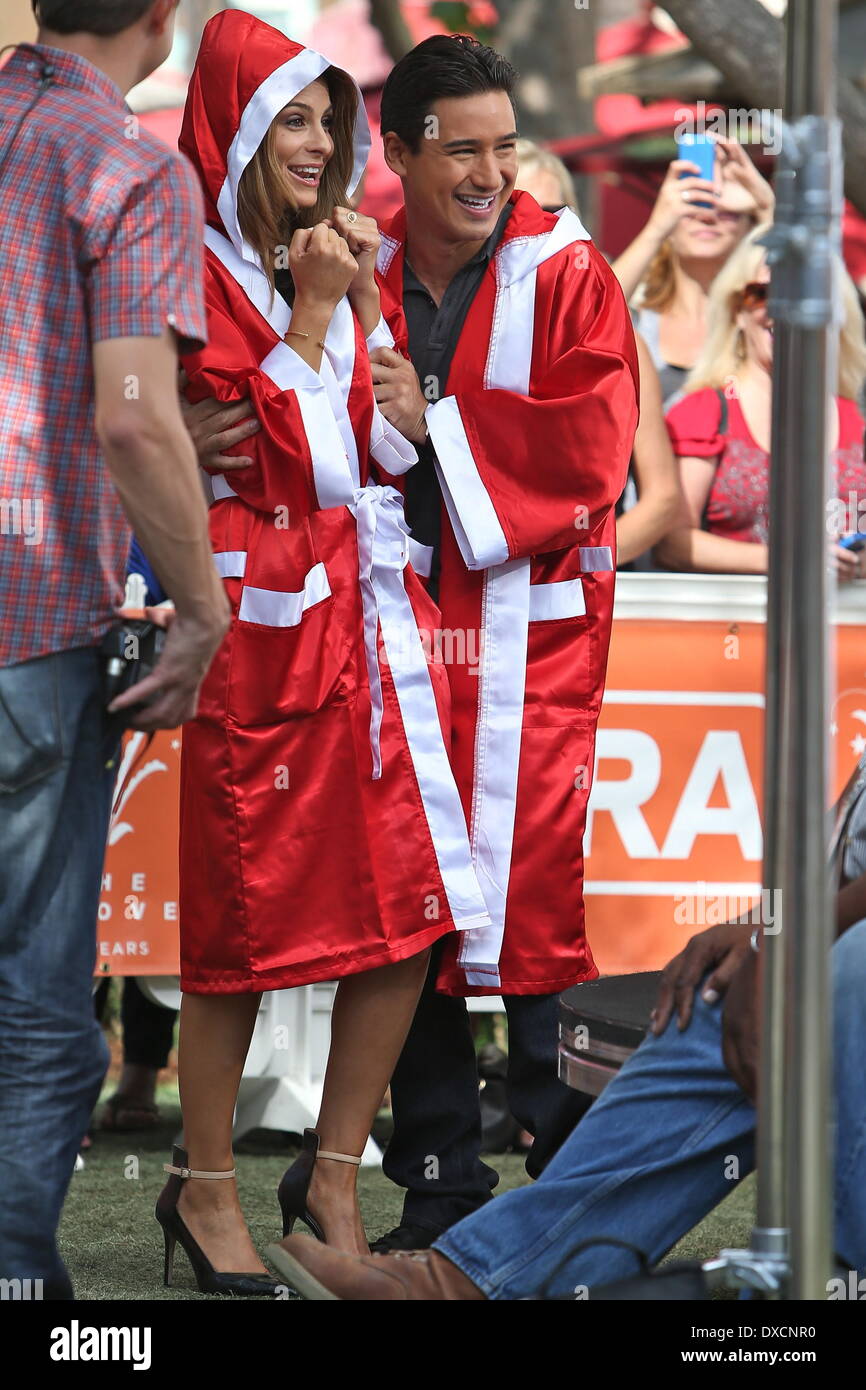 'Extra' hosts Maria Menounos and Mario Lopez wear red and white boxing ...