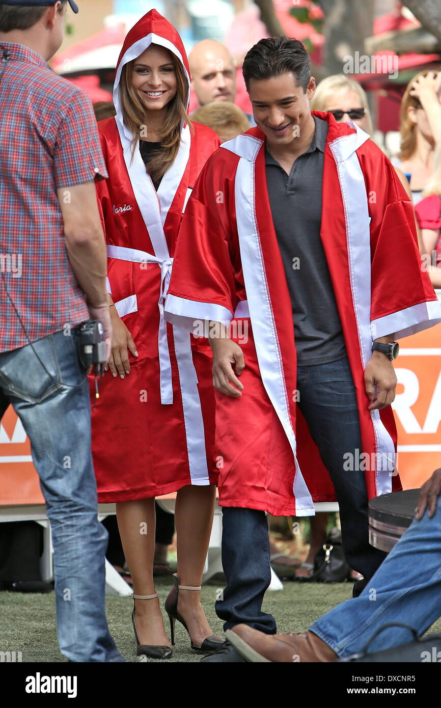 'Extra' hosts Maria Menounos and Mario Lopez wear red and white boxing ...