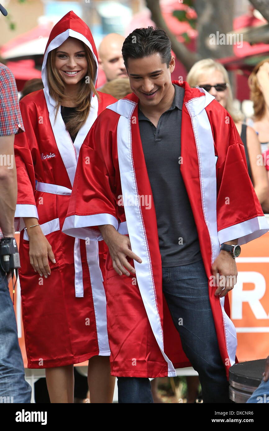 'Extra' hosts Maria Menounos and Mario Lopez wear red and white boxing ...
