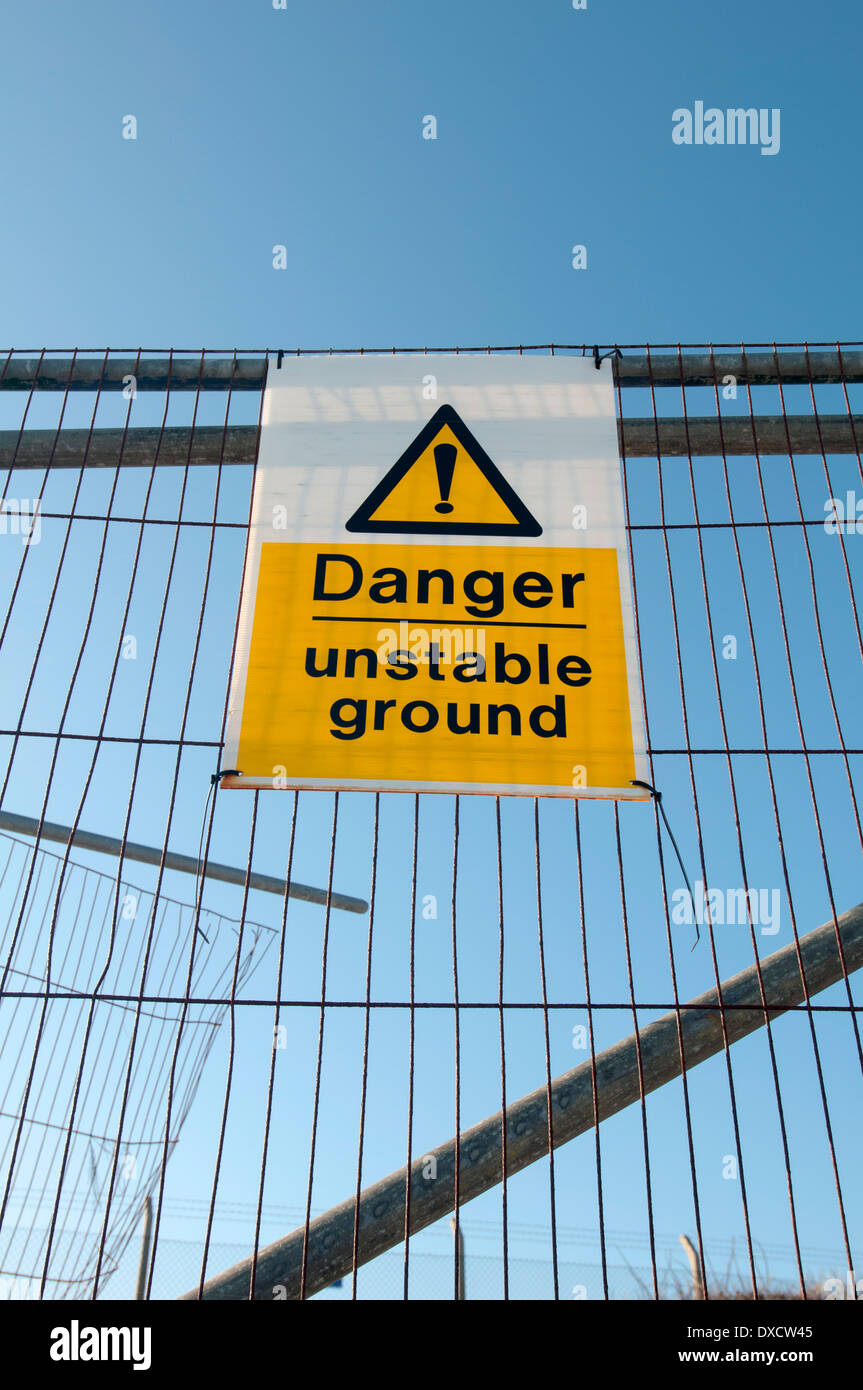 danger unstable ground sign on a metal fence Stock Photo - Alamy