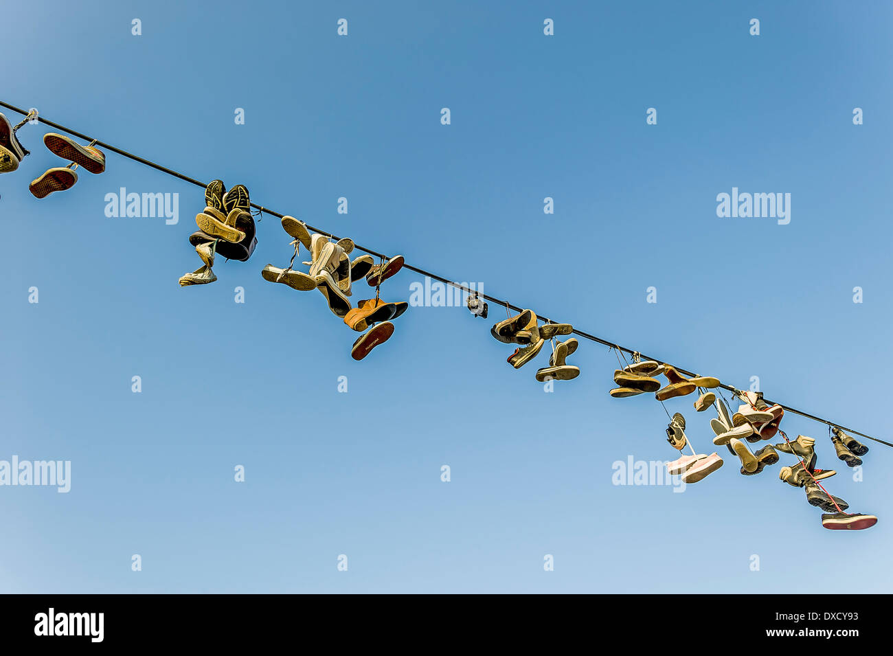 pairs of old shoes on the line Stock Photo - Alamy