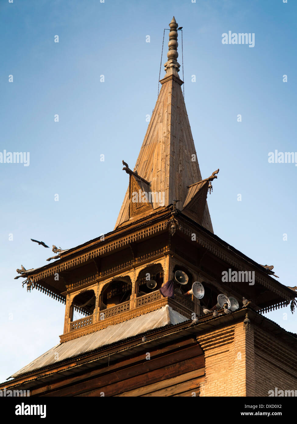 India, Kashmir, Srinagar town, wooden tower and spire of historic Jamia ...