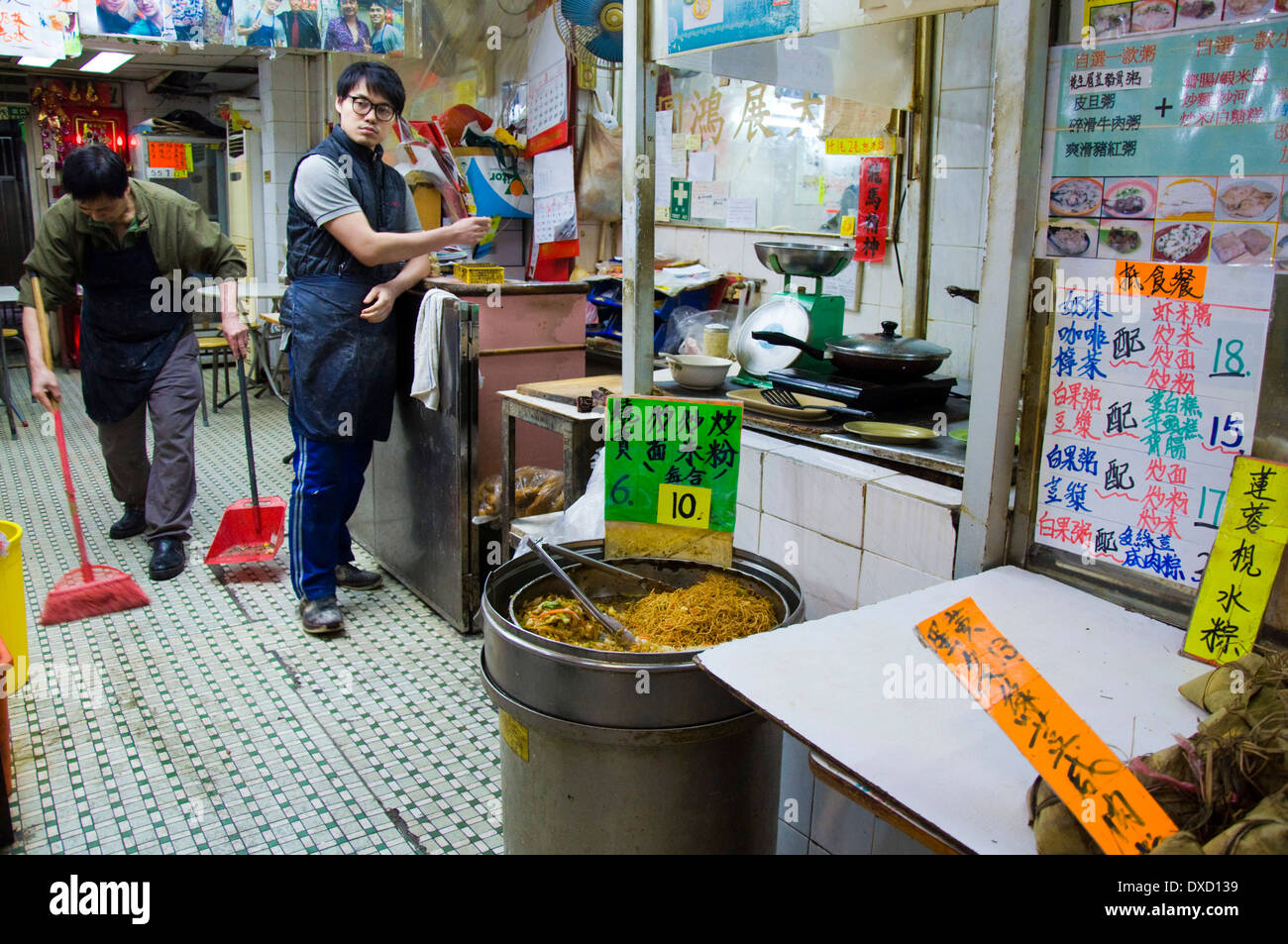 Sweeping up at a cafe and takeaway food stall on Marble Road North ...