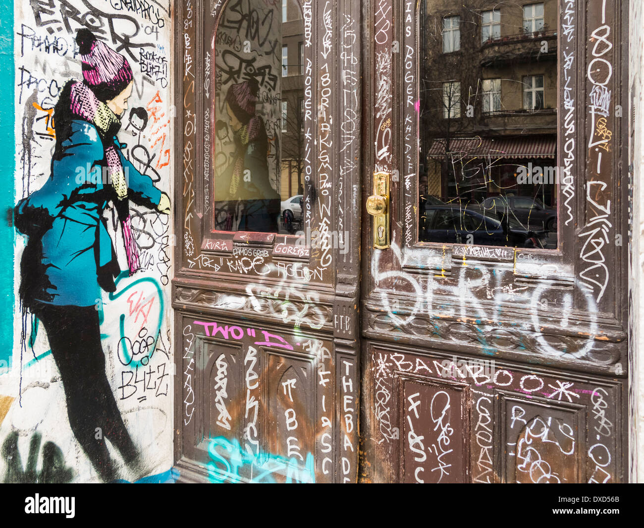 Graffiti street art on an entrance way and door in the fashionable ...