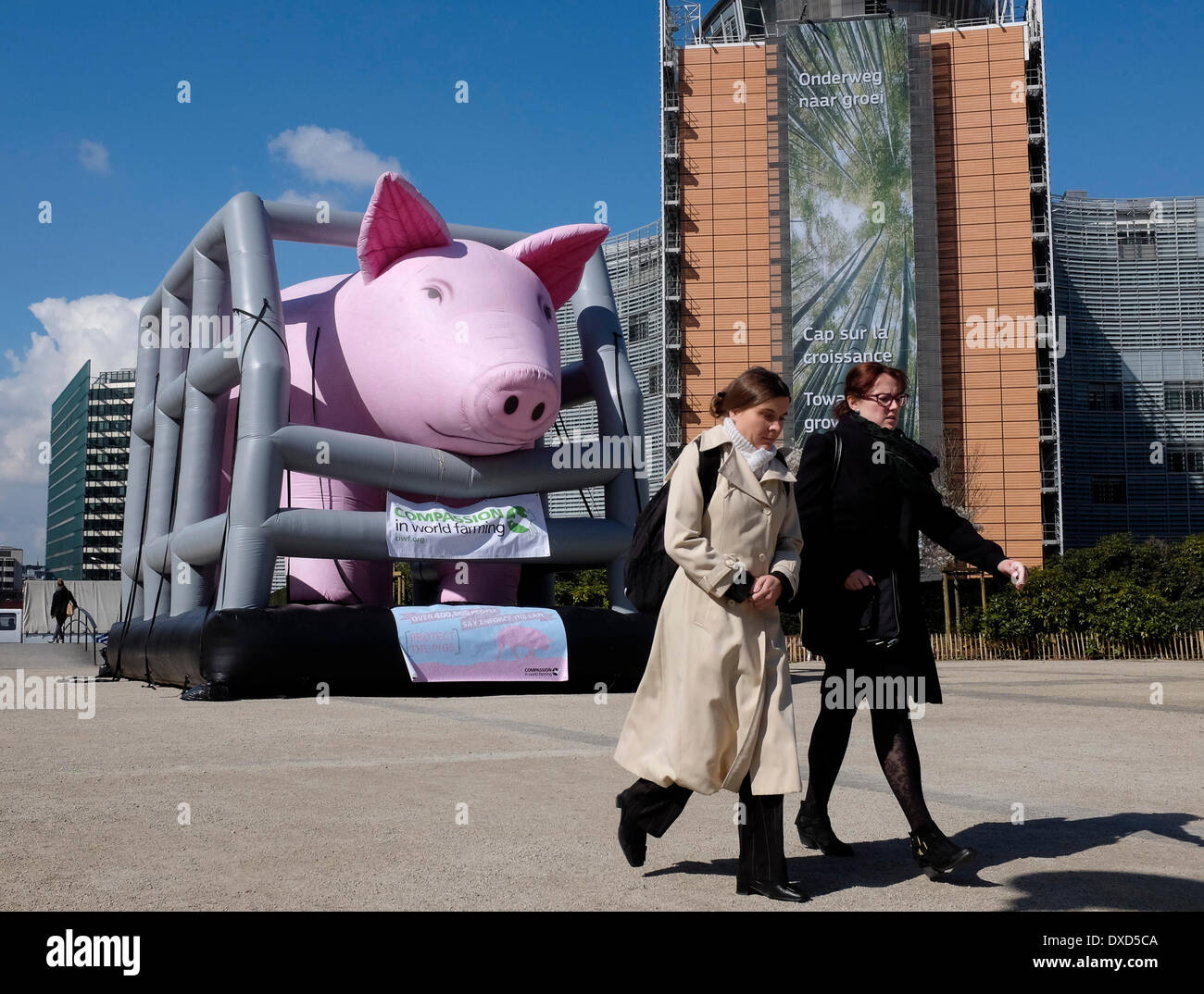 Brussels, Belgium. 24th Mar, 2014. An inflatable pig in a cage outside ...