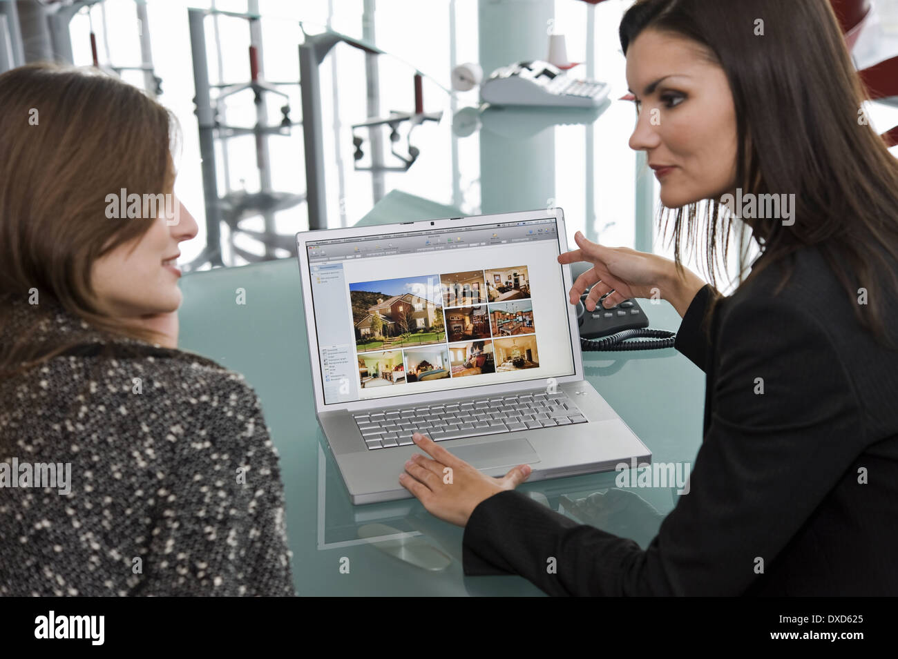 Two women at laptop computer Stock Photo - Alamy