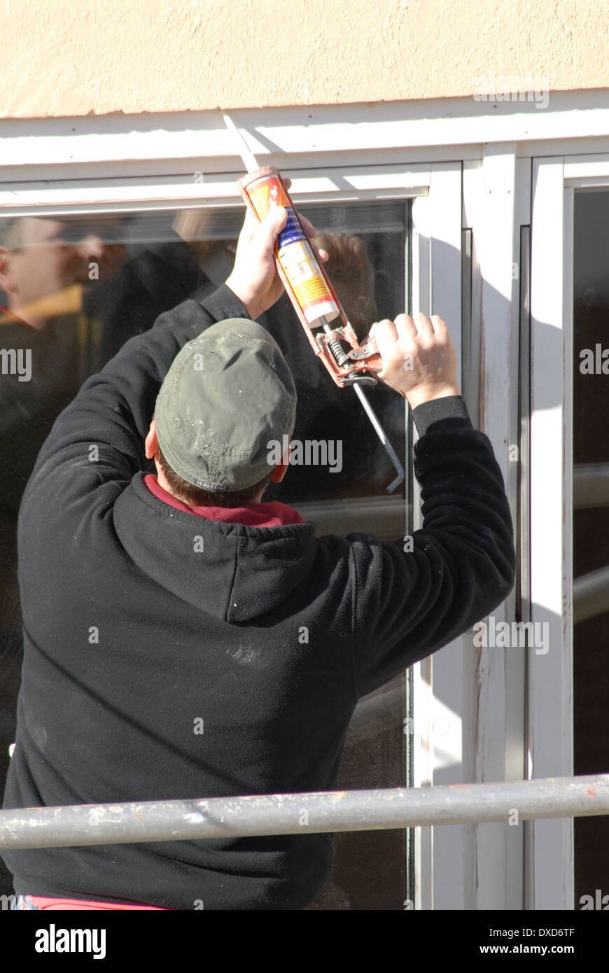 Sealing a window frame Stock Photo - Alamy