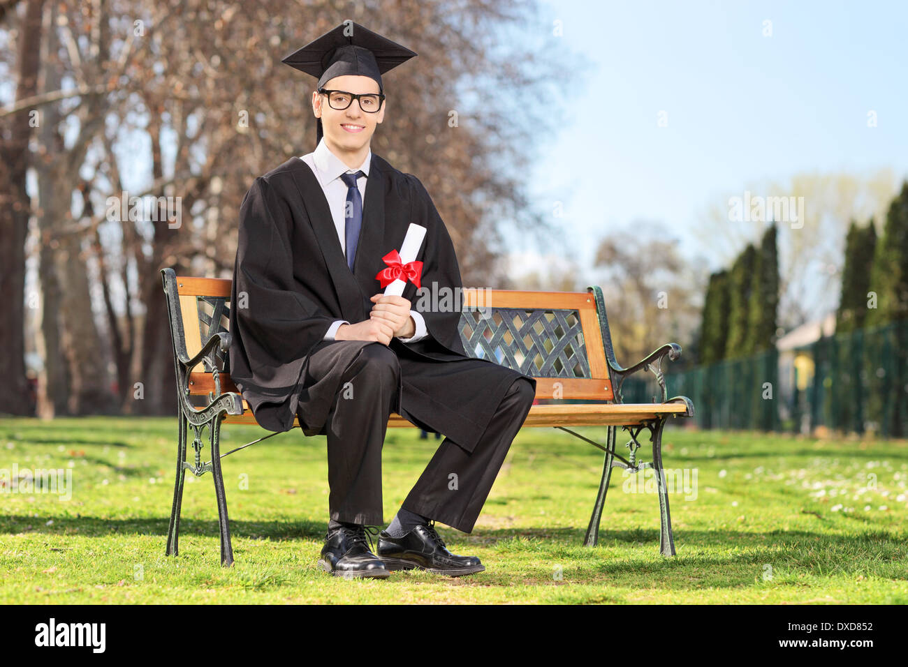 Male college graduate posing outdoors hi-res stock photography and ...