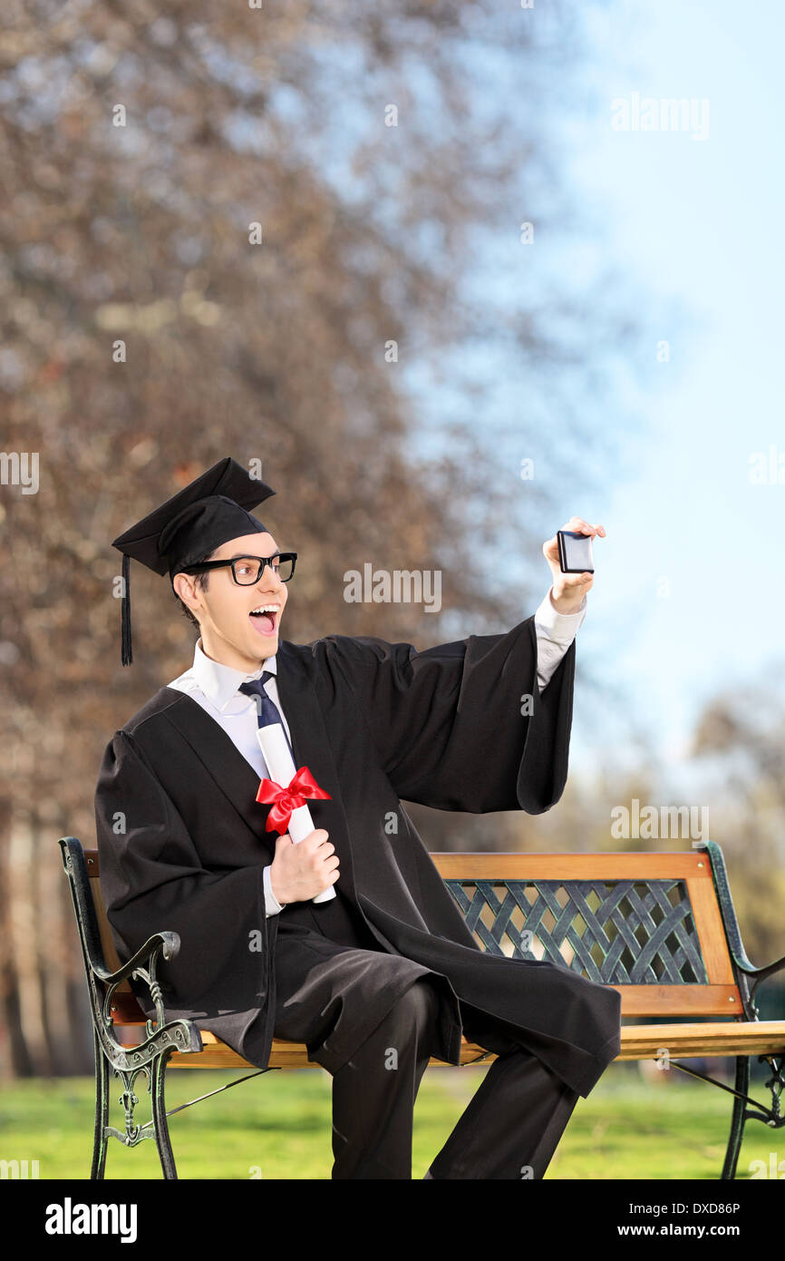 Young man graduation cap sitting hi-res stock photography and images ...