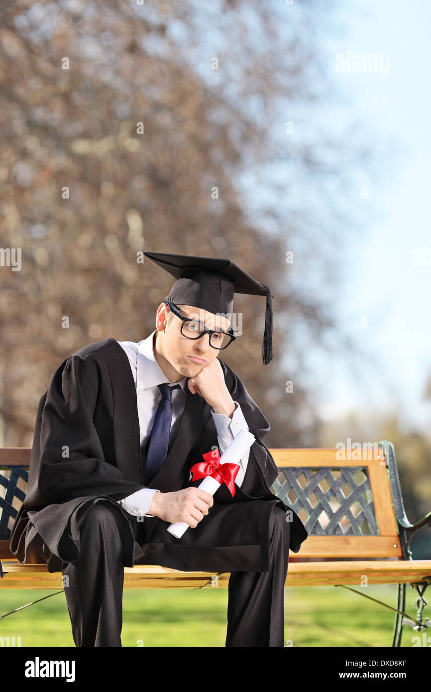 Sad student sitting on bench hi-res stock photography and images - Alamy