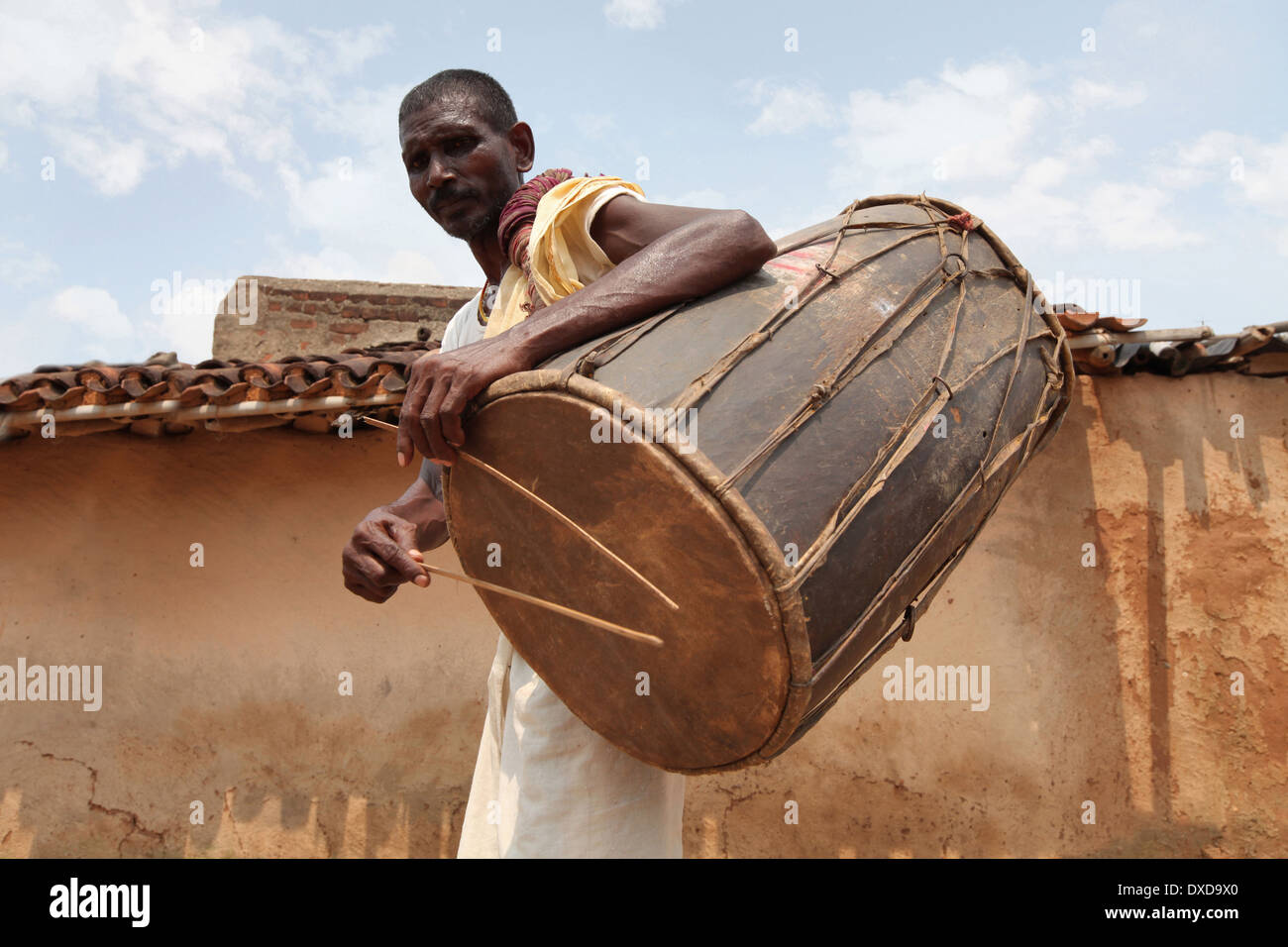 Tribal musician playing a traditional musical instrument, Nagada. Uraov ...
