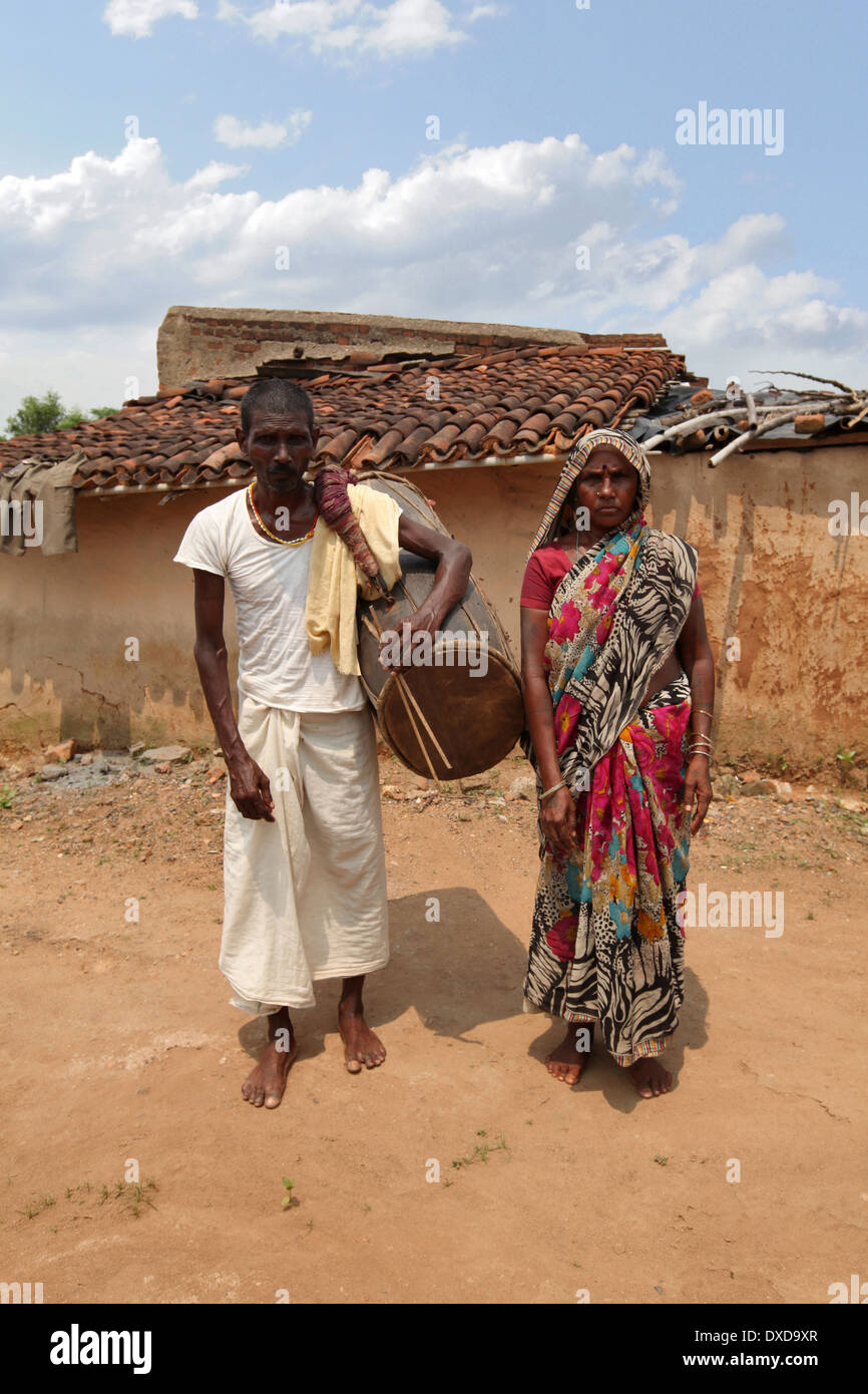 Tribal couple with traditional musical instrument dholak. Uraov tribe ...