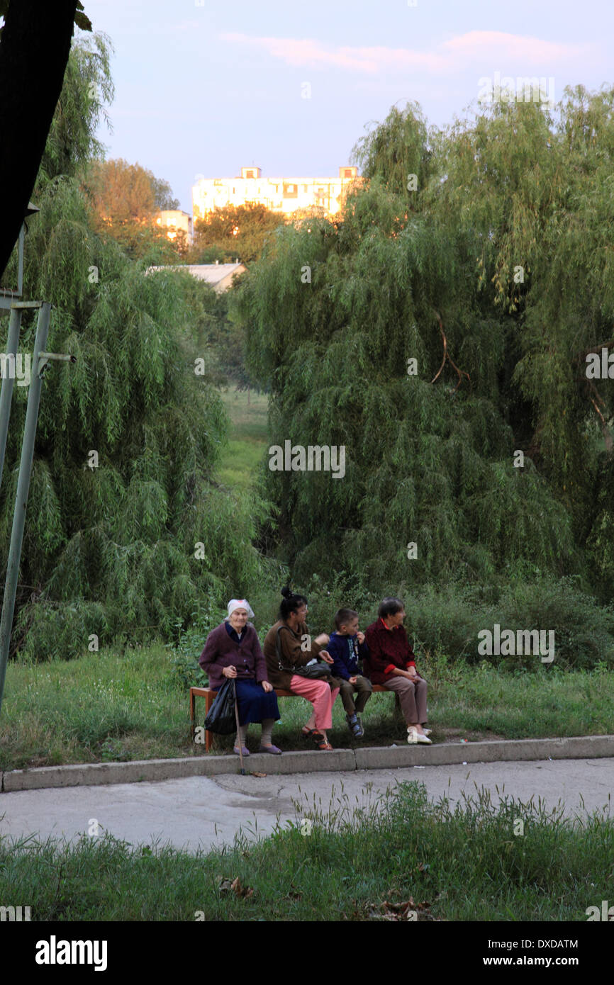 People on a bench in a park outside Tiraspol, capital of Transnistria ...