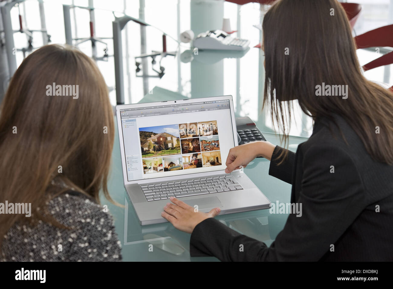 Two women at laptop computer Stock Photo - Alamy