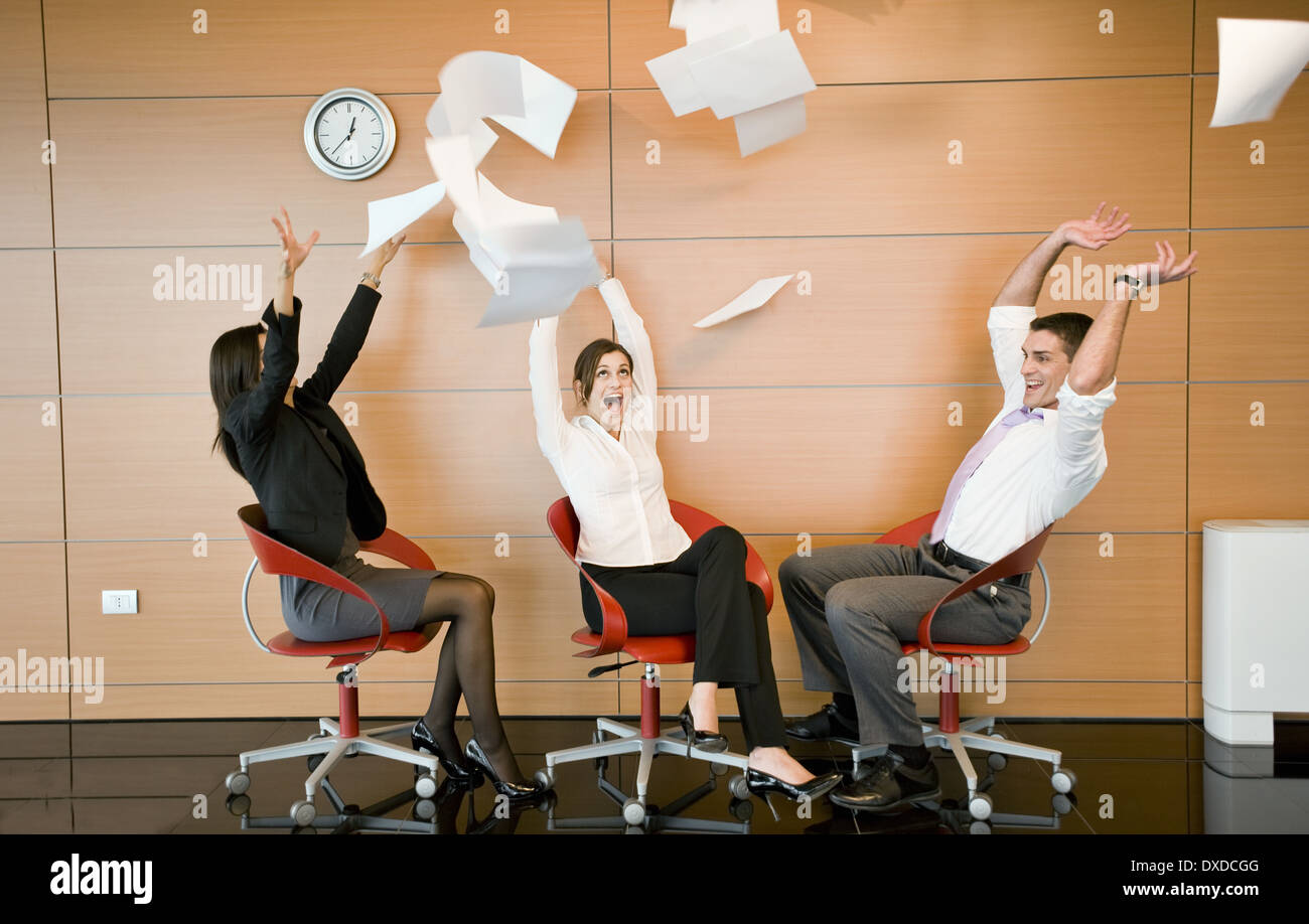 Office workers throwing documents up in the air Stock Photo - Alamy