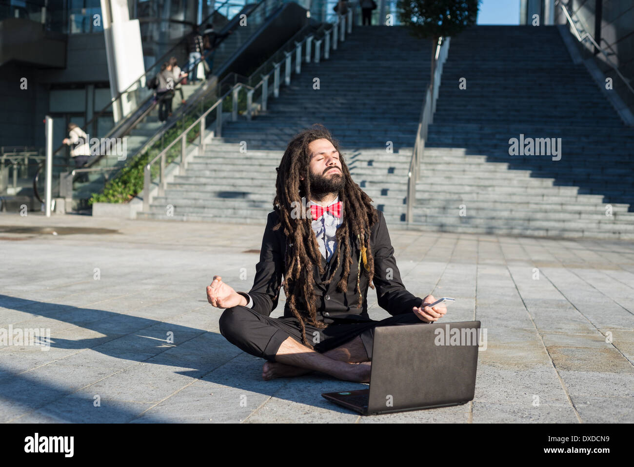 Stylish elegant dreadlocks businessman in business landscape Stock ...