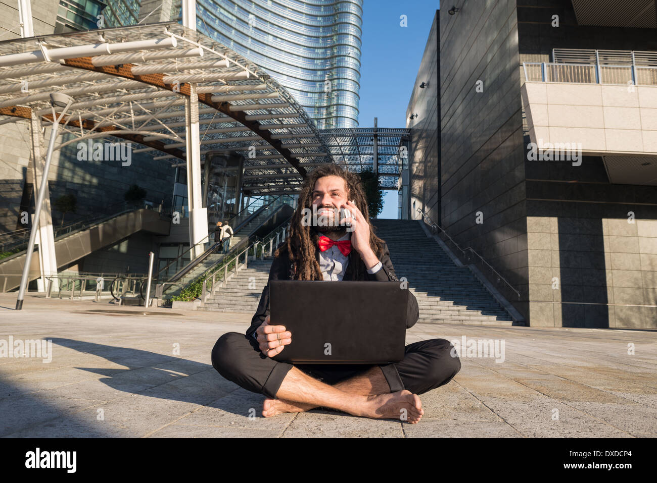 Stylish elegant dreadlocks businessman in business landscape Stock ...