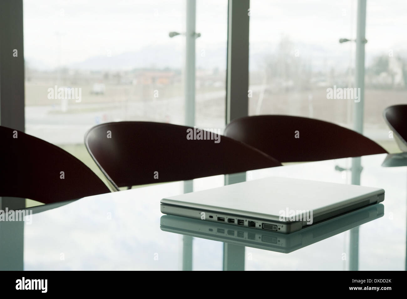Laptop on conference table Stock Photo - Alamy