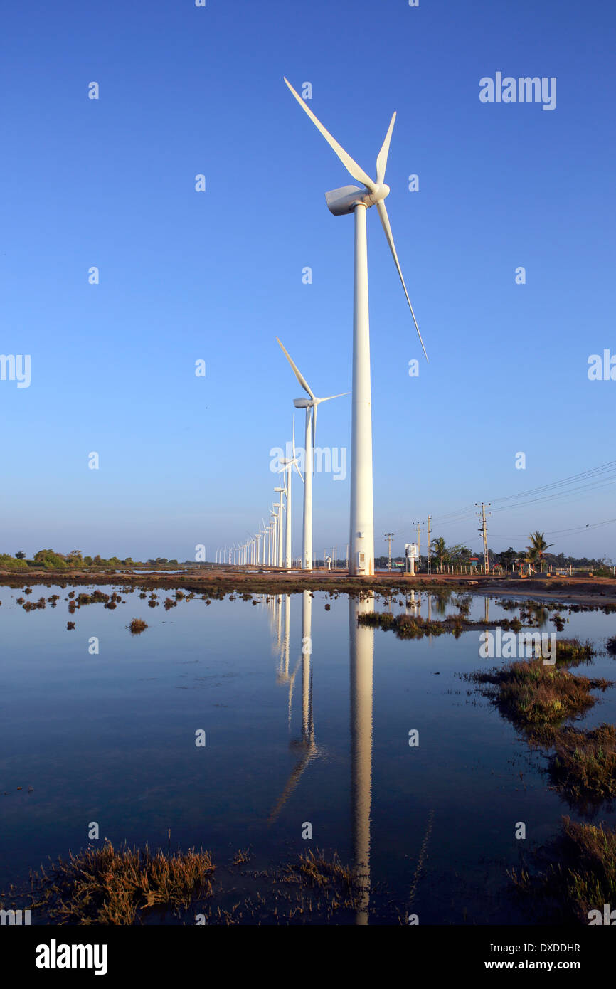 Turbines and salt ponds at wind farm on the edge of Puttalam Lagoon in ...