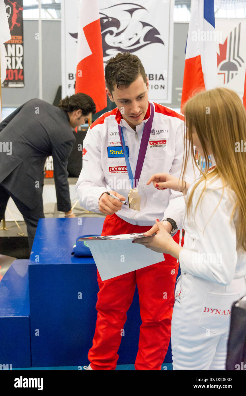 KAUTER (SUI) winner of gold medal signs autograph for young fencer at ...