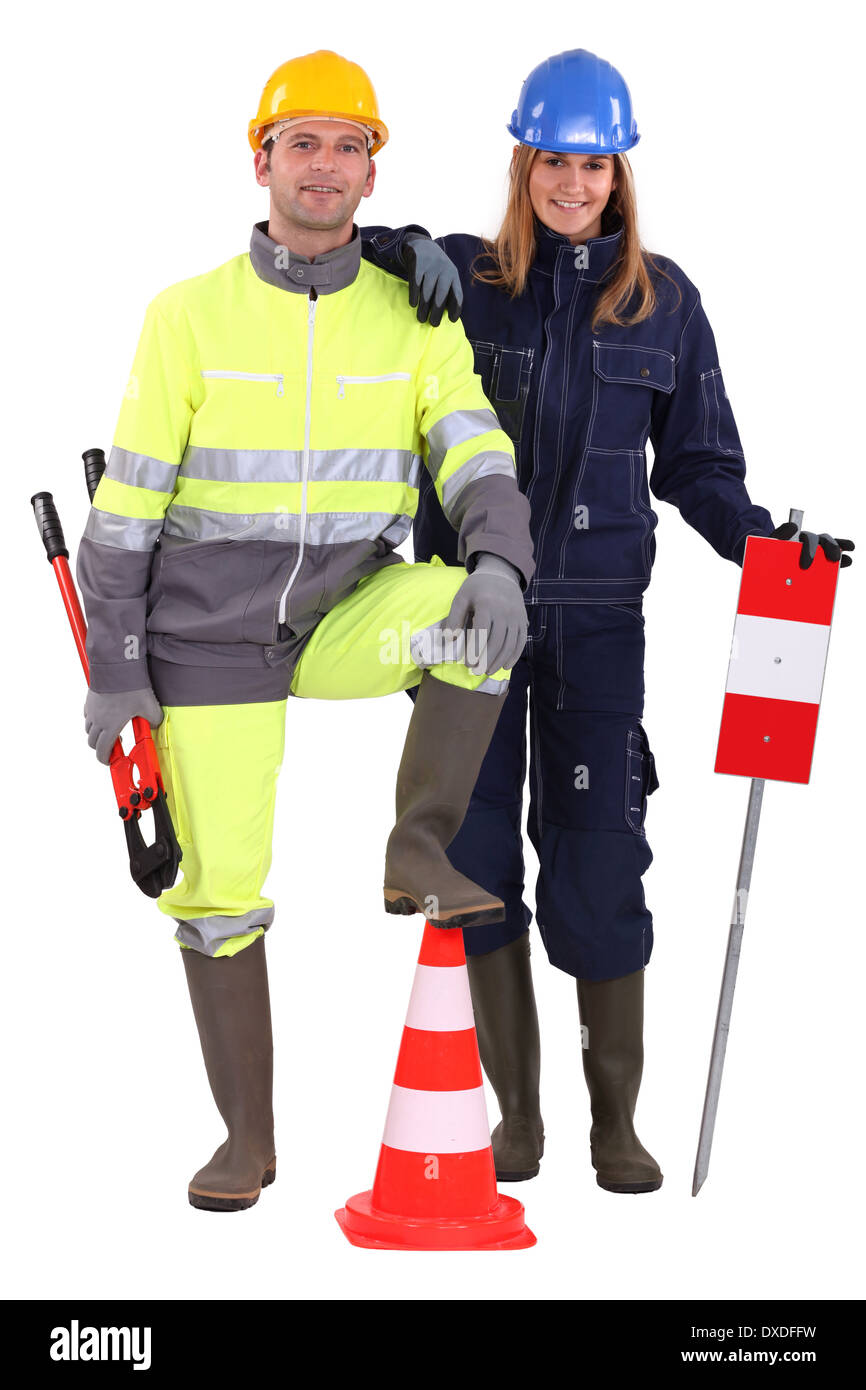 Construction crew with tools and warning signs Stock Photo - Alamy