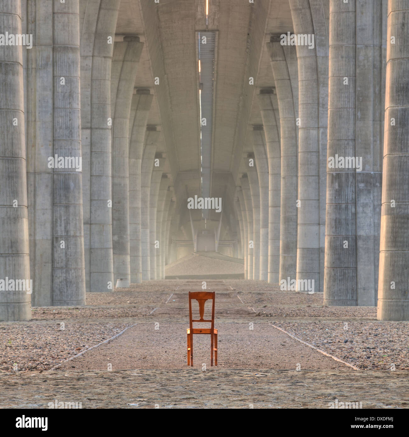 Abandoned chair under the highway bridge at sunrise Stock Photo - Alamy