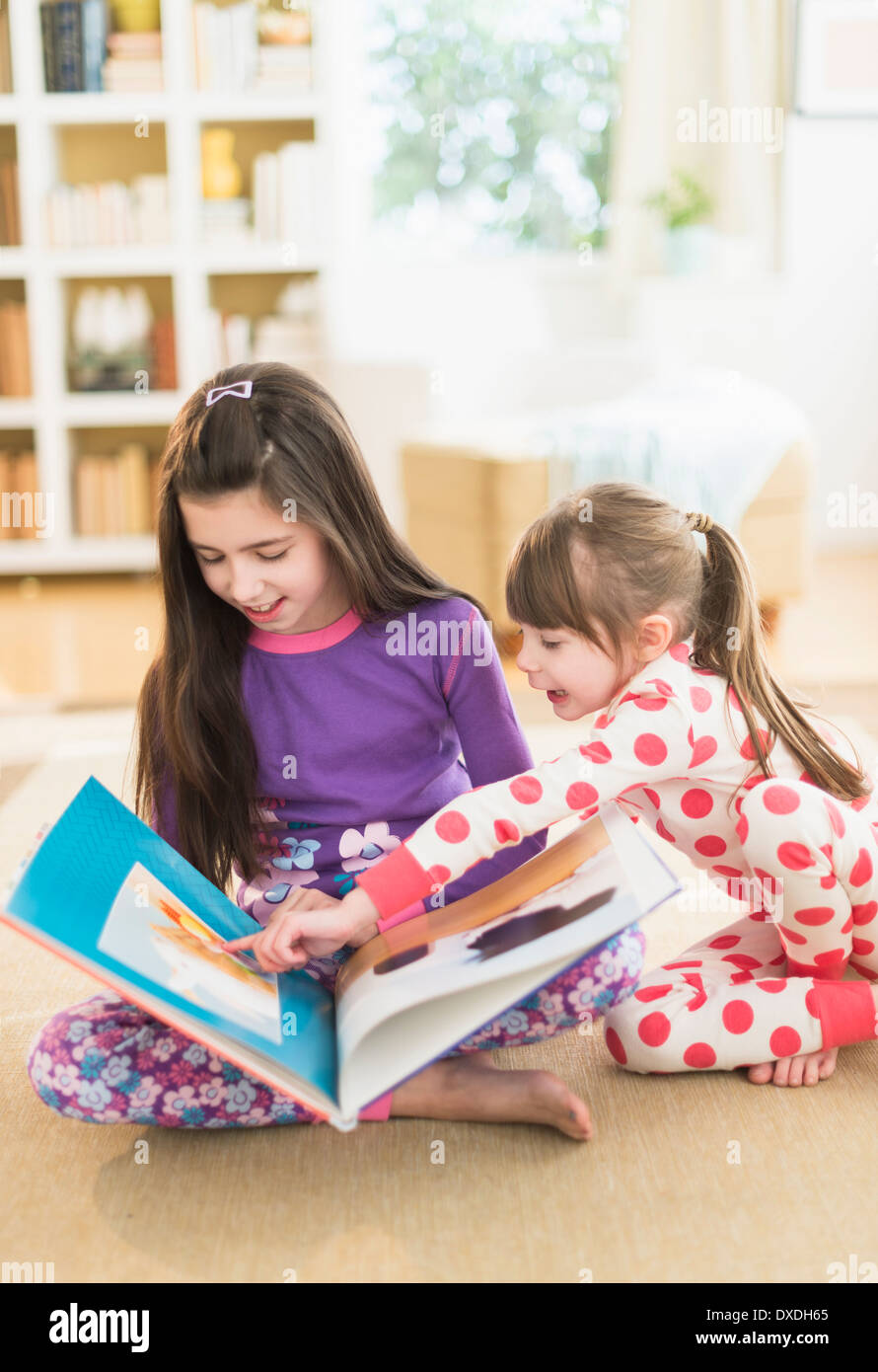 Two girls reading book hi-res stock photography and images - Alamy