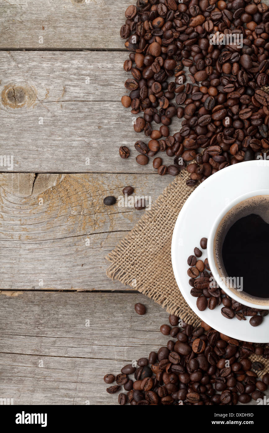 Coffee cup and beans on wooden table background with copy space Stock ...