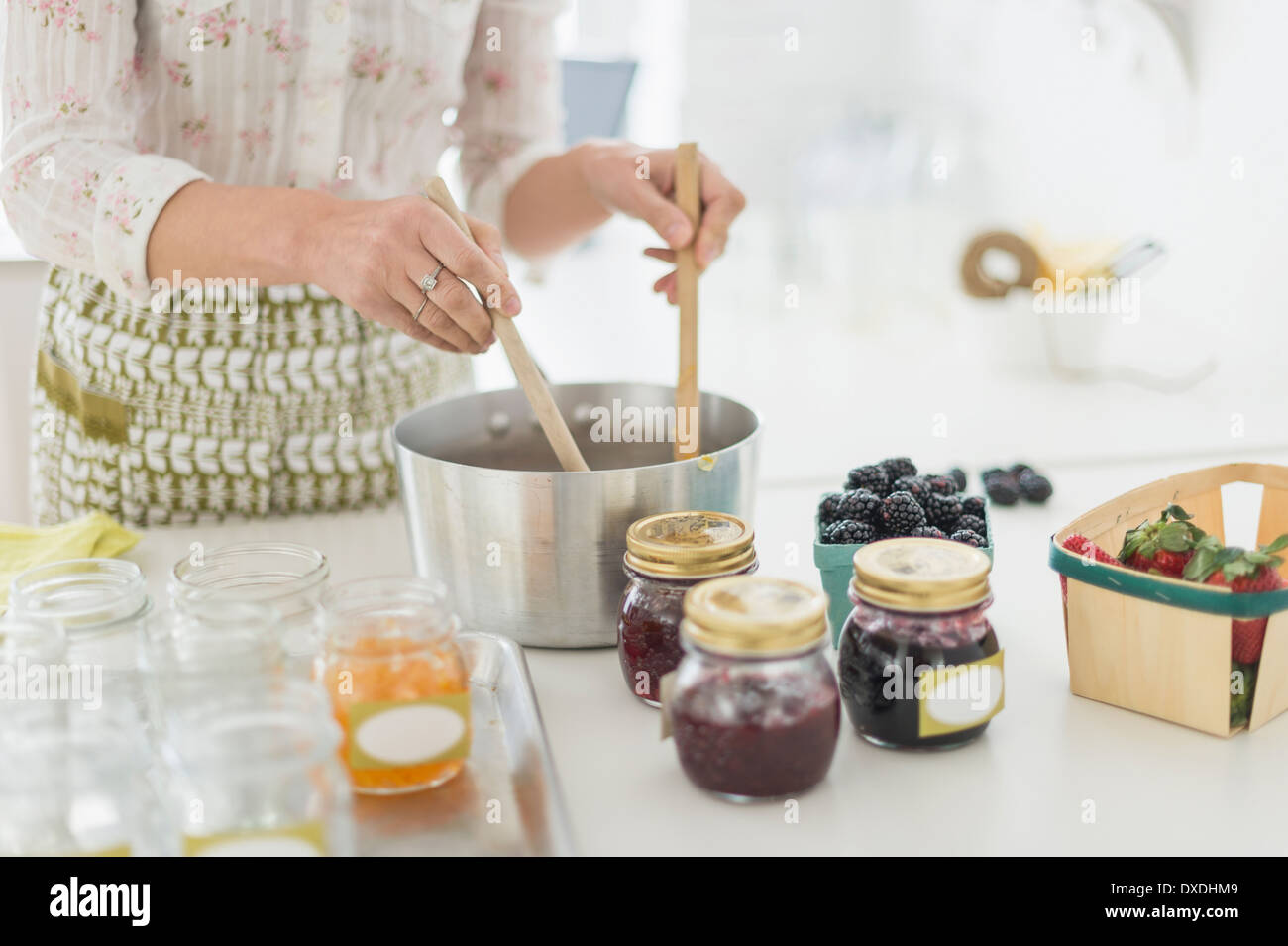 Woman making jam in kitchen hi-res stock photography and images - Alamy