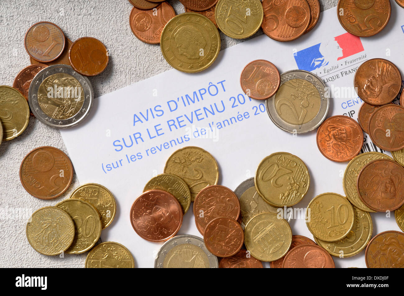 French Income Tax Receipt and Eruo Coins Stock Photo - Alamy