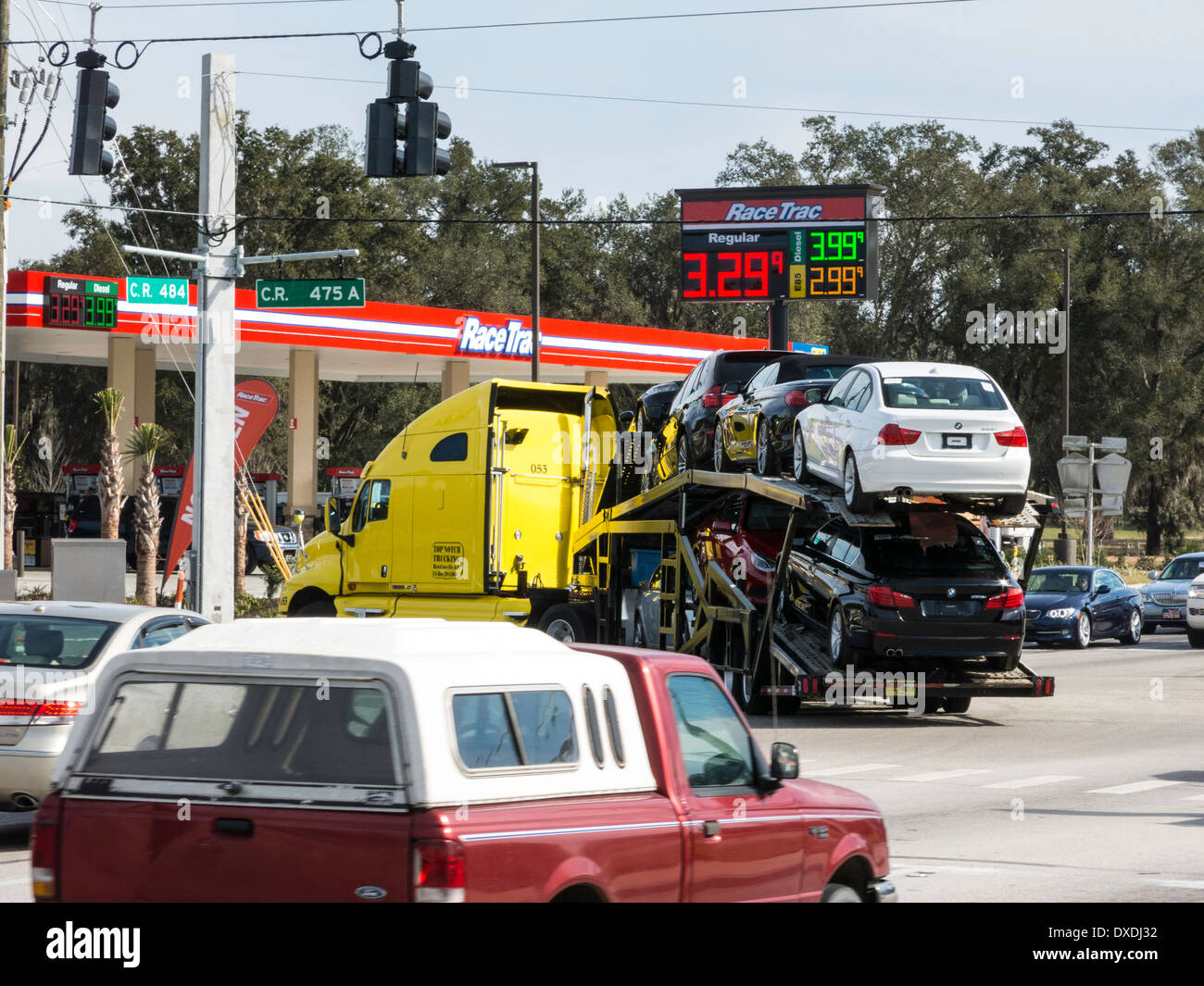 Yellow Auto Transporter Truck on City Street, USA Stock Photo - Alamy