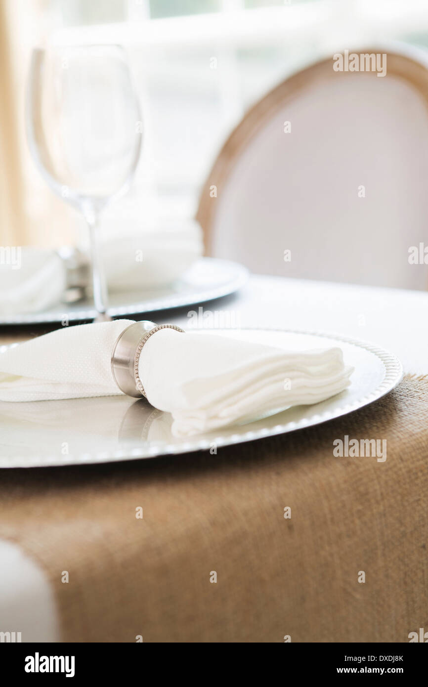 Simple and elegant place setting with plate charger and napkin Stock ...