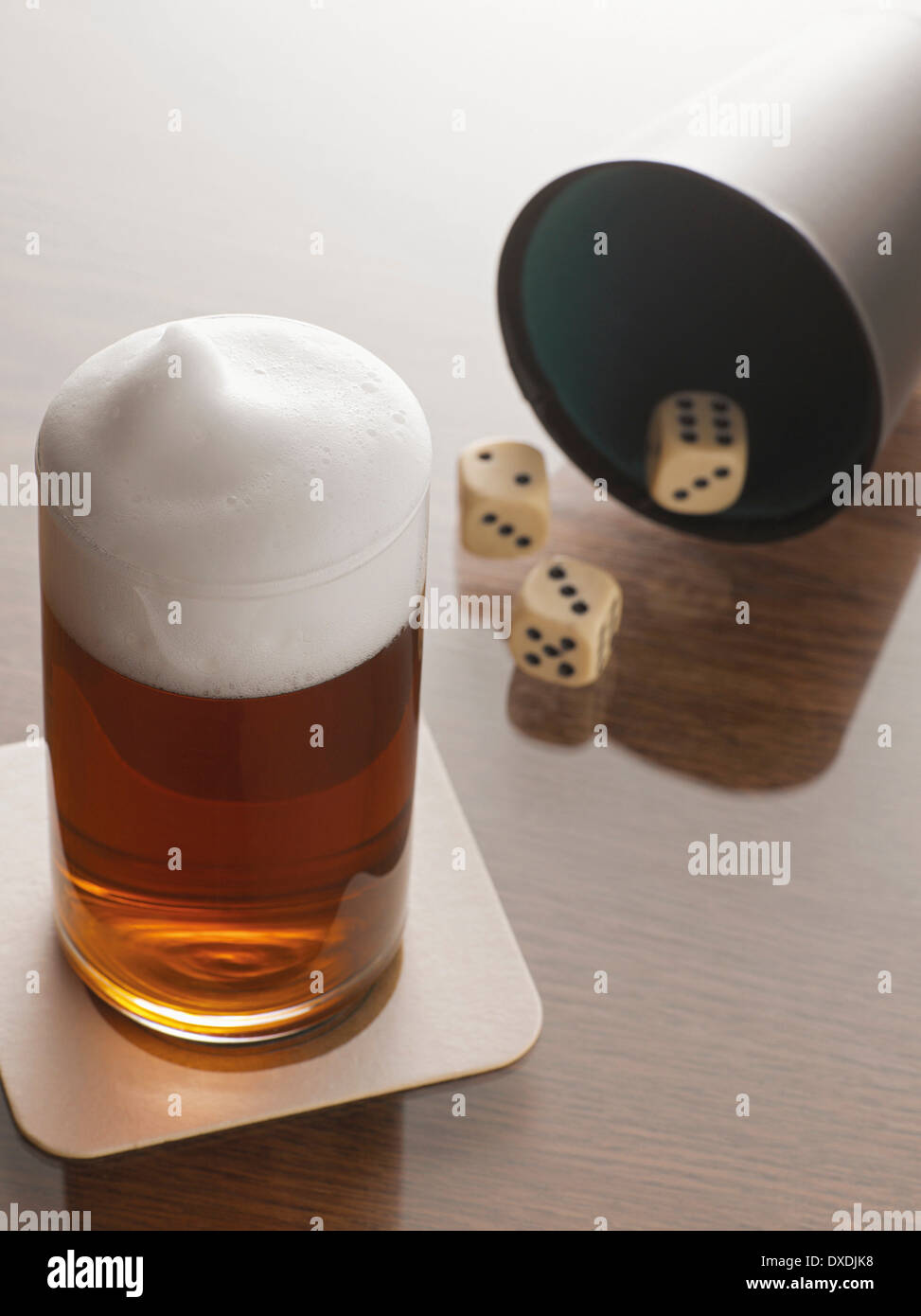 Glass of Dark Beer with Dice in the background, Studio Shot Stock Photo ...