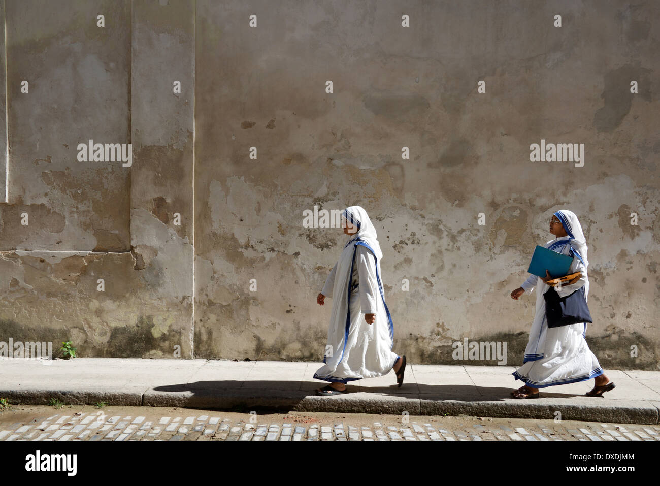 Two Nuns walking single file Old Havana Cuba Stock Photo - Alamy