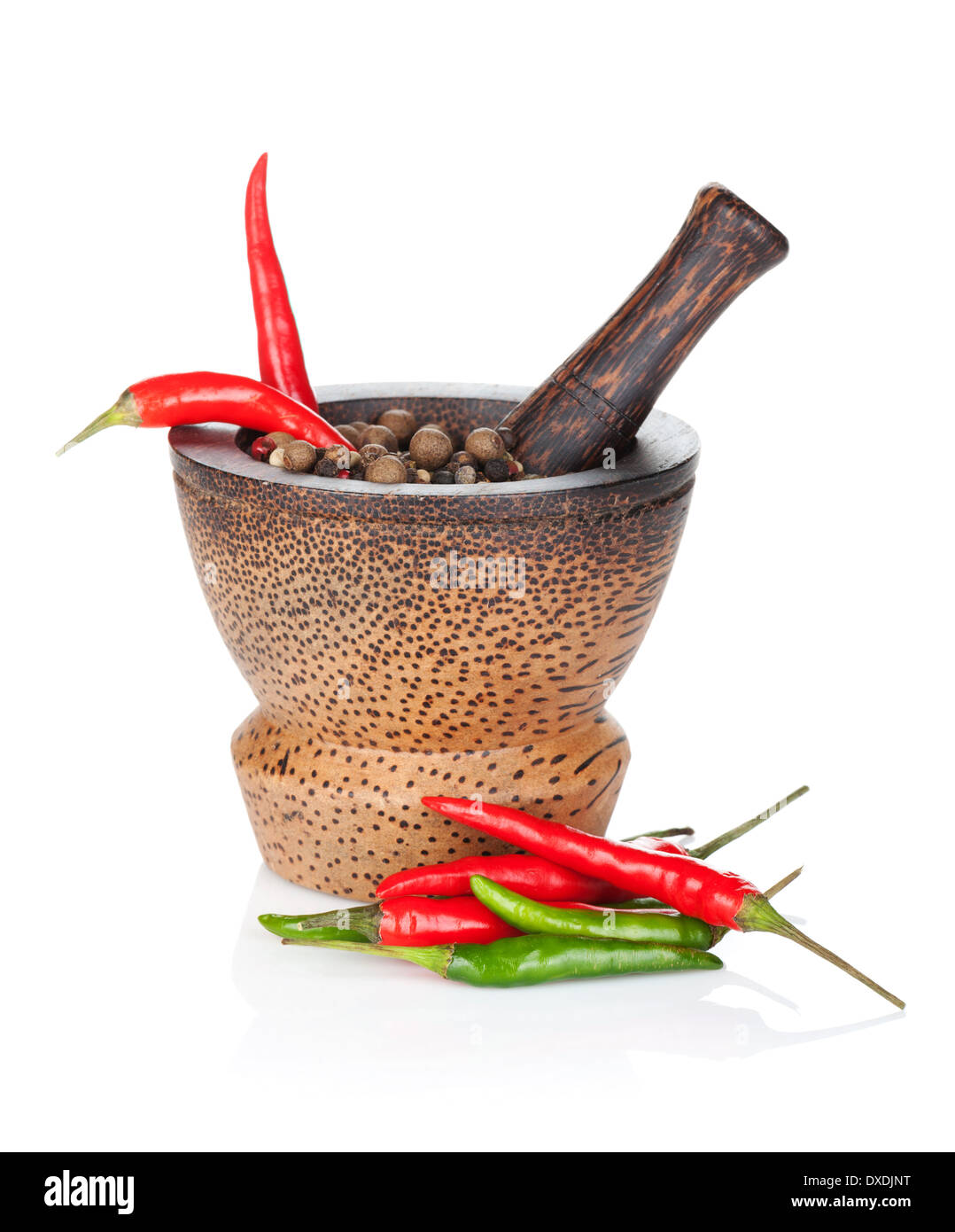 Mortar and pestle with red hot chili pepper and peppercorn. Isolated on ...