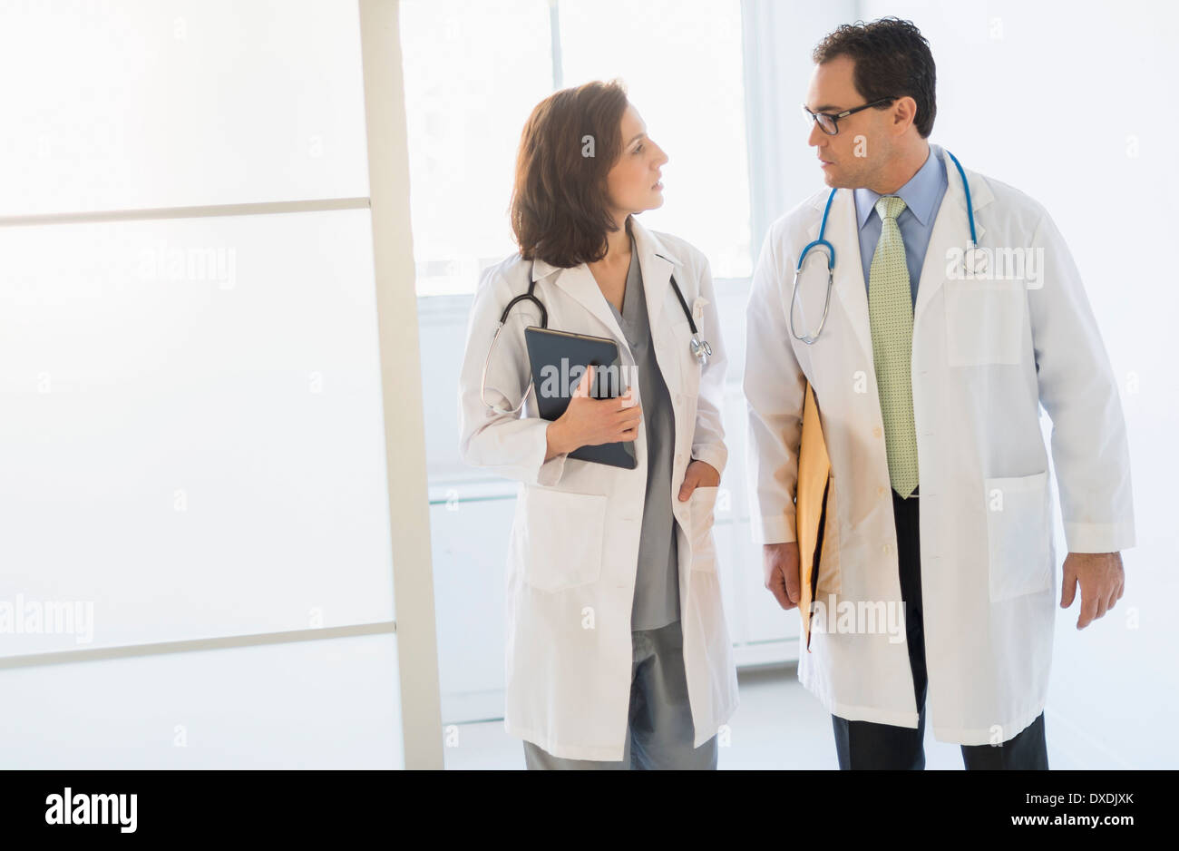Two doctors talking in hospital Stock Photo - Alamy