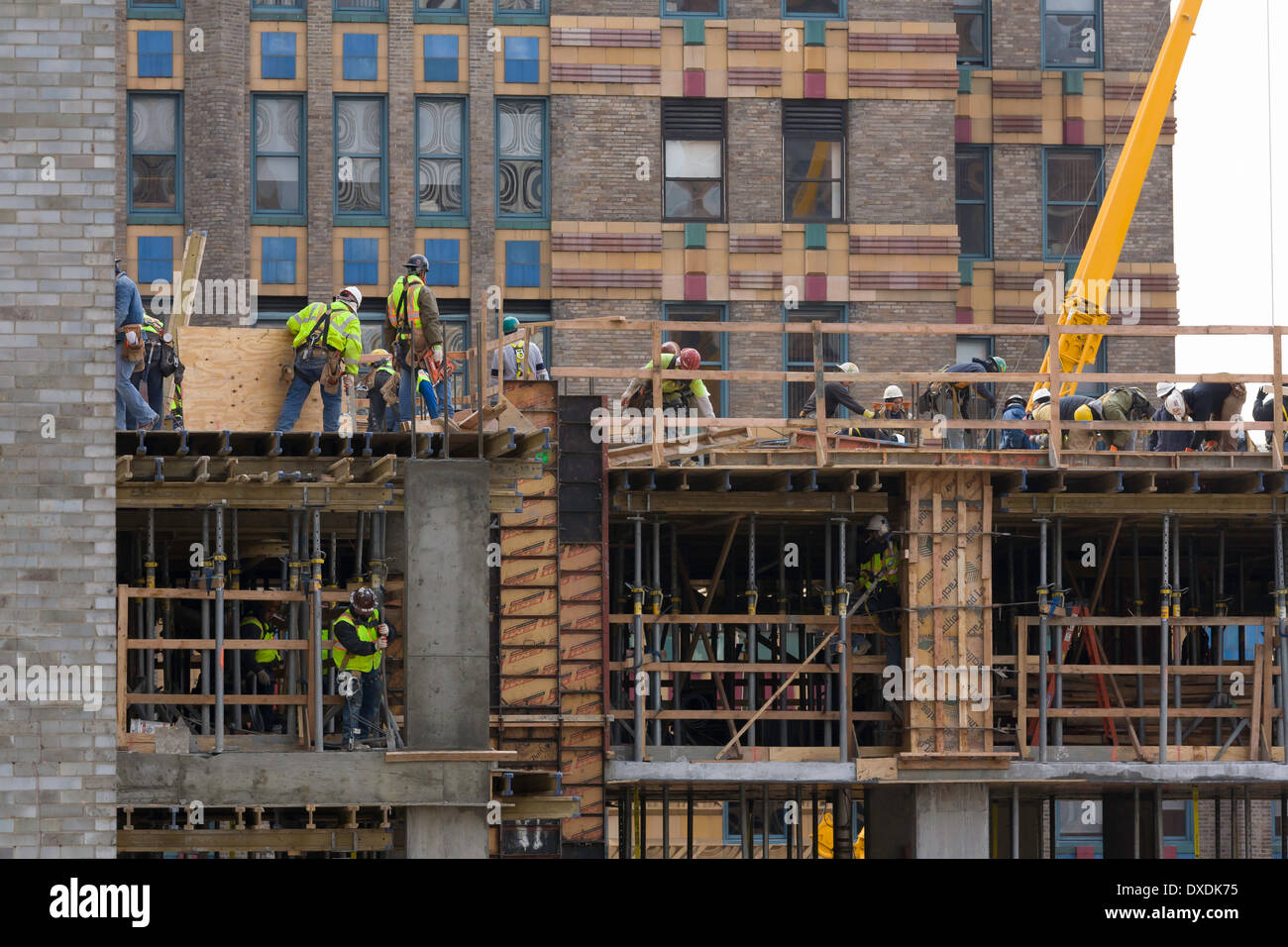 High-rise Building Construction Site with Tradesmen, NYC, USA Stock ...