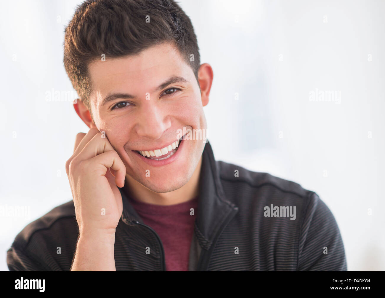 Portrait of smiling young man Stock Photo - Alamy