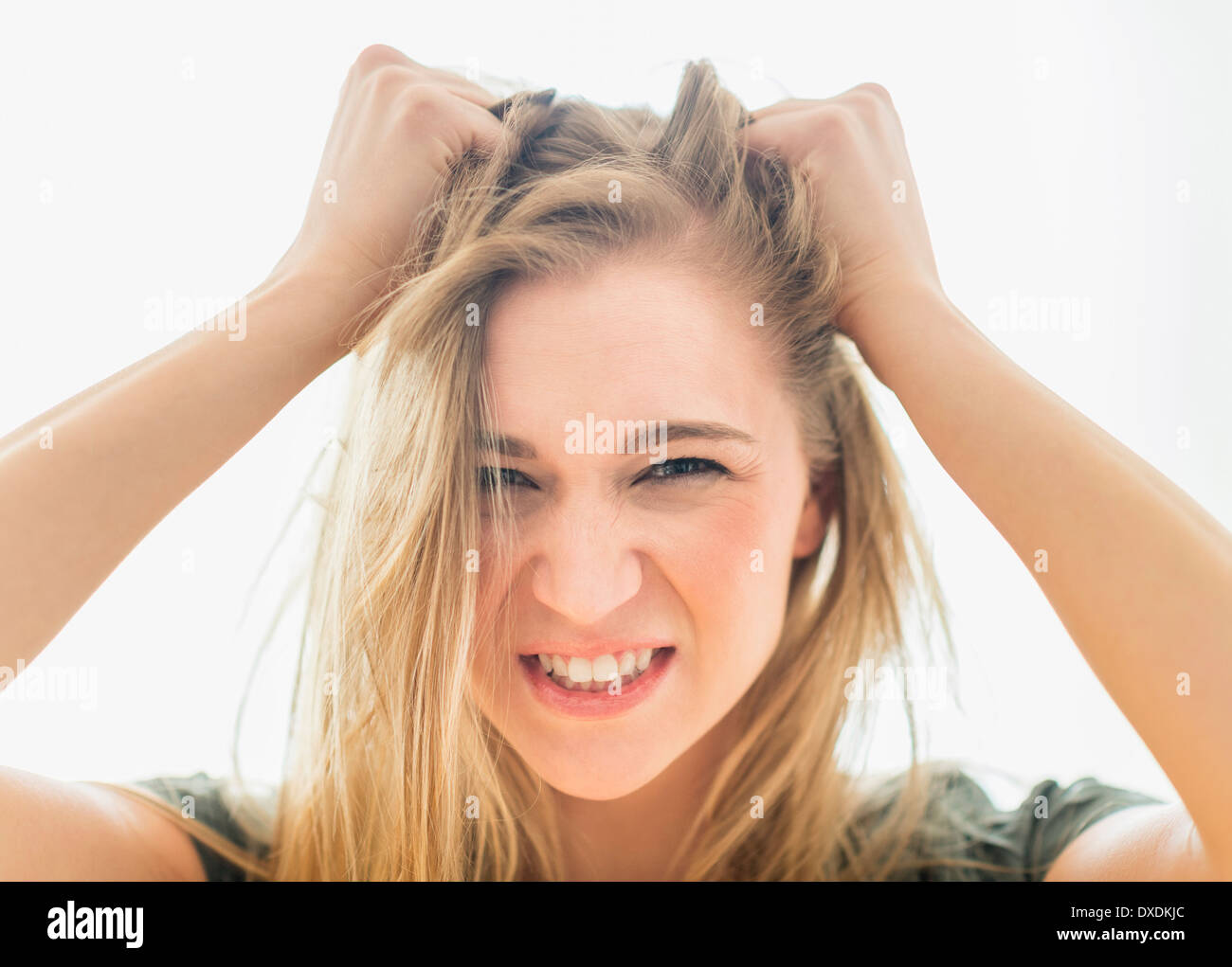Frustrated woman pulling hair Stock Photo - Alamy