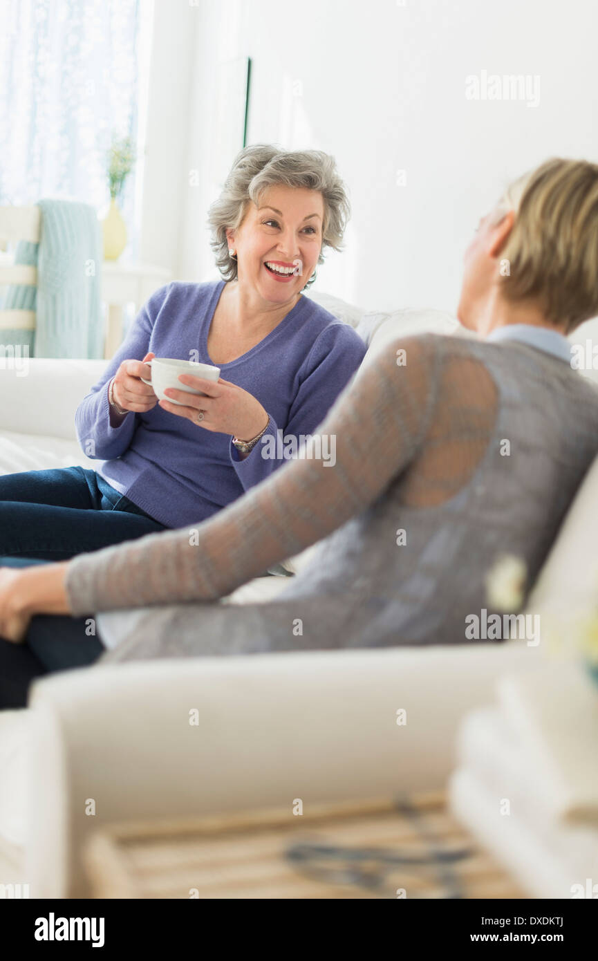 Two women talking sofa couch hi-res stock photography and images - Alamy