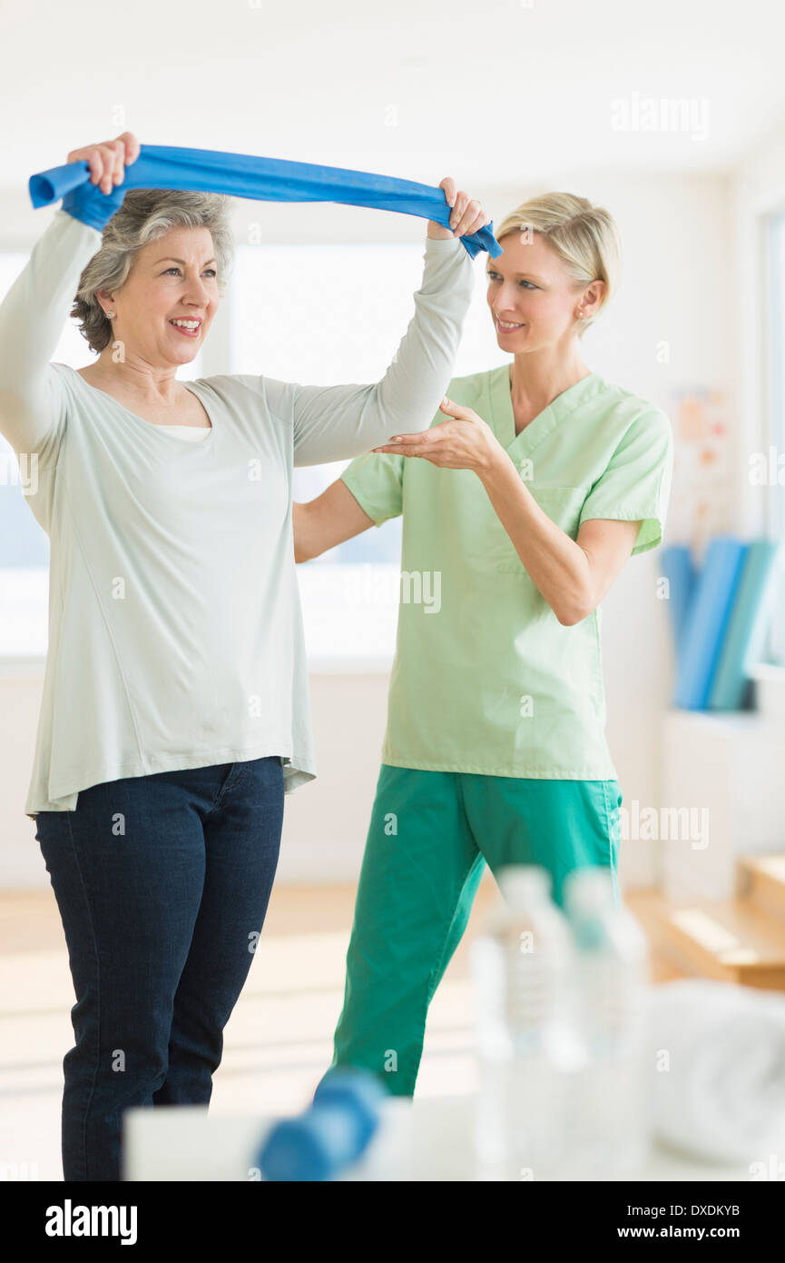 Mature woman with personal trainer hi-res stock photography and images ...