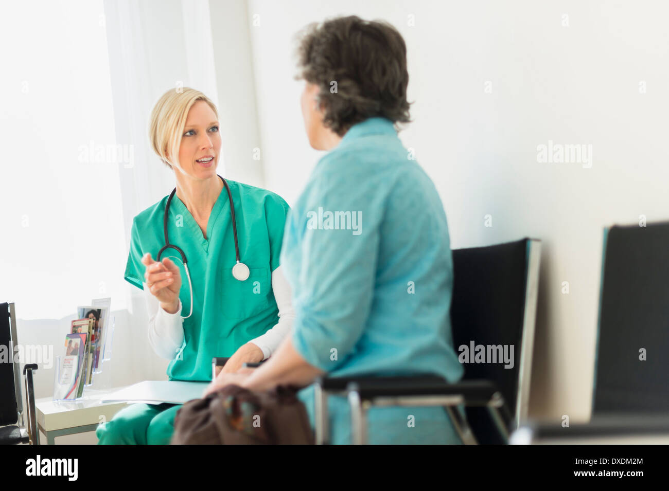 Woman waiting doctor sitting hi-res stock photography and images - Alamy