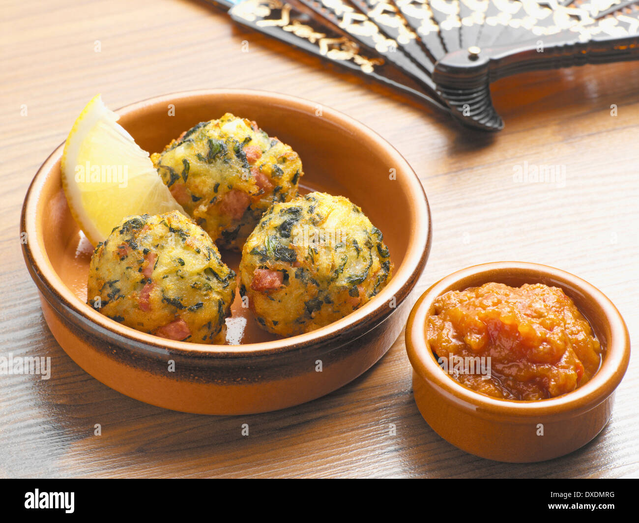 Fried Potatao Balls with Lemon Wedge and Bowl of Salsa, Studio Shot ...