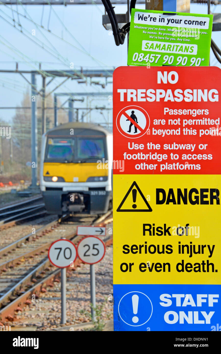 Samaritans contact notice wedged into the top of warning signs on ...